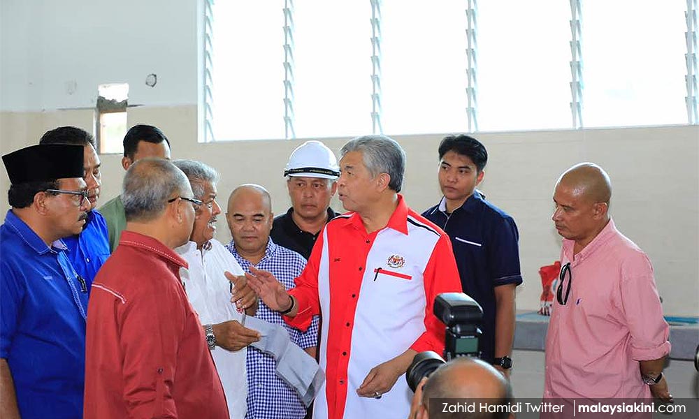 Zahid makes feuding MP and Umno chief shake hands in public